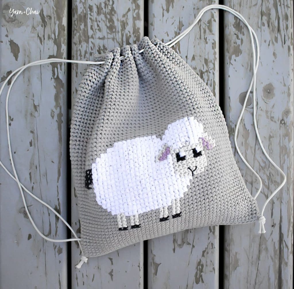 Cross-stitched Lamb Cinched Backpack